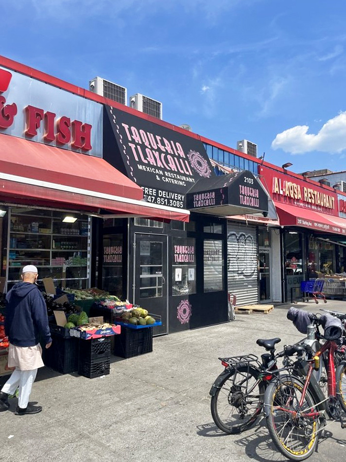The sidewalk scene completes the experience&mdash;produce vendors next door, bicycles parked outside, and the promise of culinary adventure within.