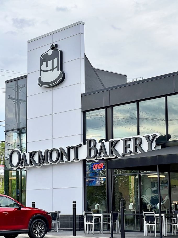 The modern exterior of Oakmont Bakery promises contemporary delights inside. That cake logo isn't just signage&mdash;it's a bat signal for dessert lovers everywhere.