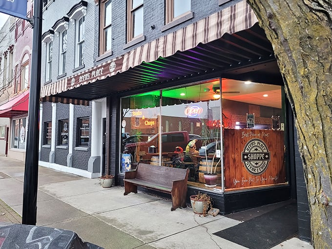 As evening approaches, the storefront glows with invitation. That wooden bench outside is perfect for the "too full to walk yet" moment.