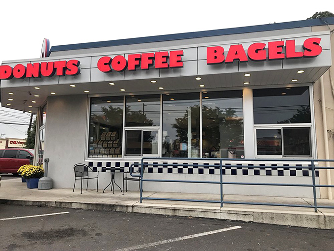 The red block letters announce life's essentials with admirable directness. DONUTS, COFFEE, BAGELS&mdash;sometimes the simplest signs point to life's greatest pleasures.