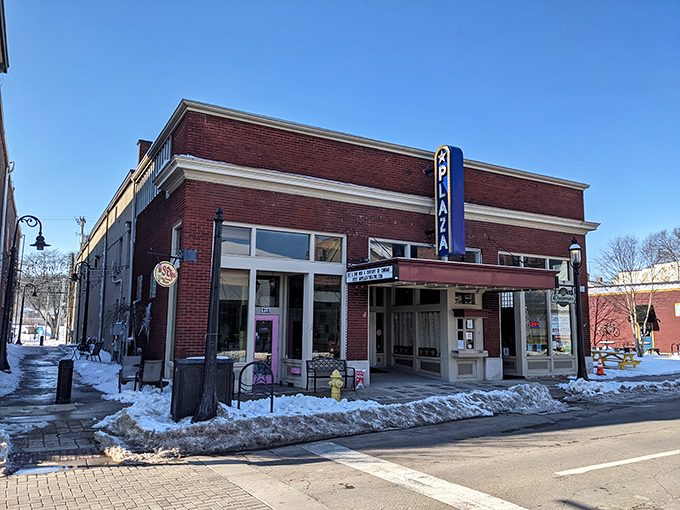 Winter can't dim The Plaza's charm, as its classic marquee stands defiant against both the snow and the homogenization of modern movie-going experiences.