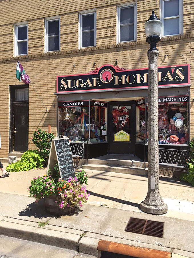 The welcoming exterior with its vintage lamp post and flower planters invites passersby to step back in time and indulge in sweet nostalgia.