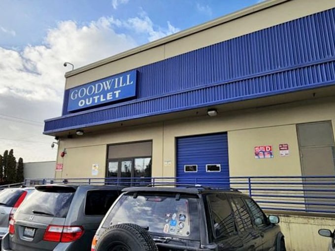The Goodwill Outlet sign glows against Seattle's characteristically moody sky&mdash;a beacon for bargain hunters and sustainability champions alike. 
