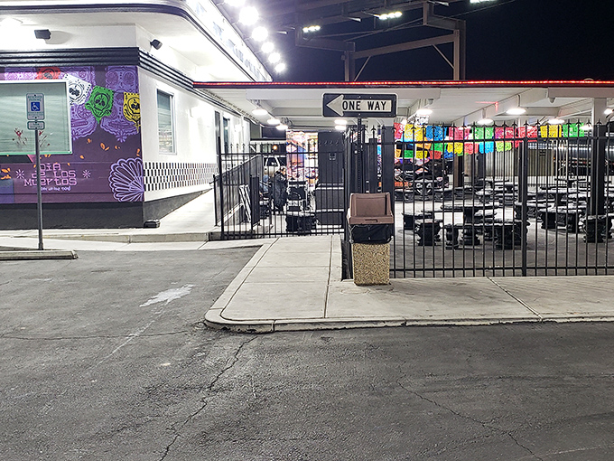Even after dark, the taco pilgrimage continues. The colorful papel picado banners flutter like flags welcoming hungry travelers home.