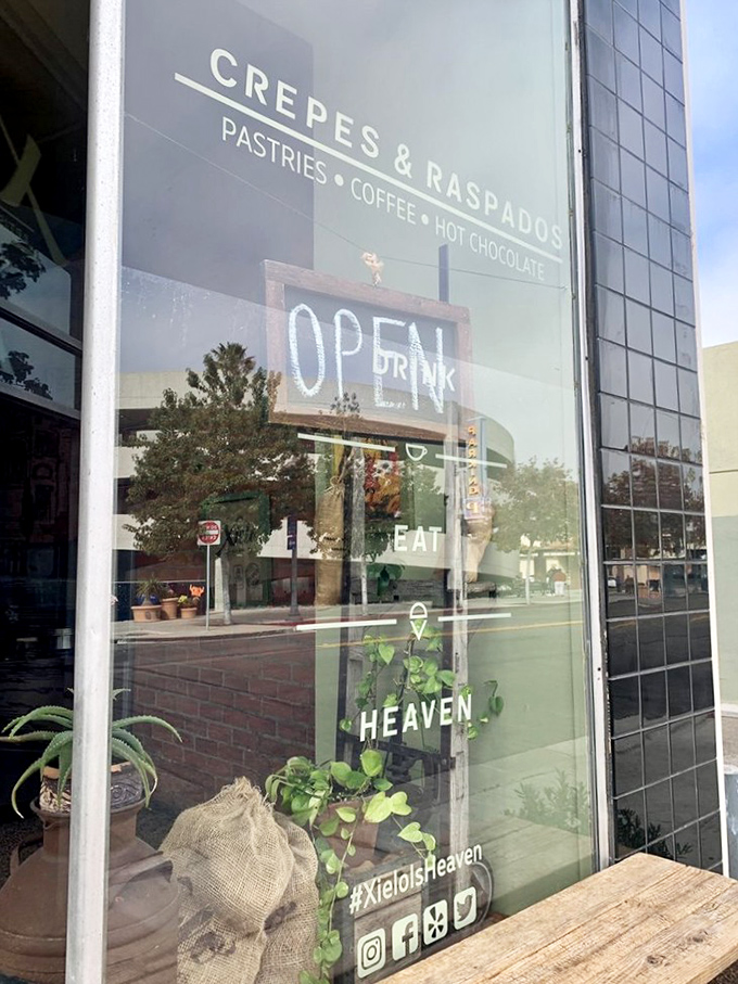 The window says it all: "Crepes & Raspados" and "#XieloIsHeaven." Truth in advertising has never been sweeter.
