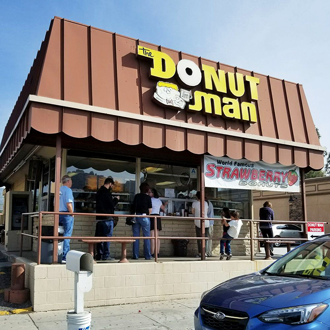 The "World Famous Strawberry Donut" banner announces when the seasonal star has arrived, triggering joy across Southern California's donut enthusiasts.