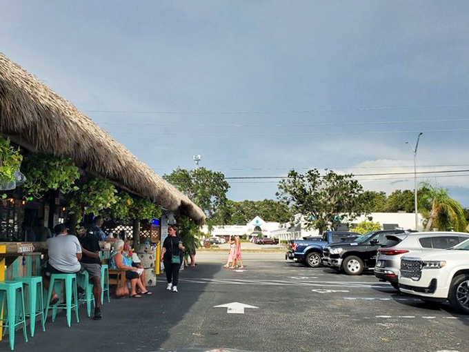 The outdoor seating area offers that quintessential Florida experience &ndash; dining under palm fronds with a gentle breeze while tourists wonder why they live up north.