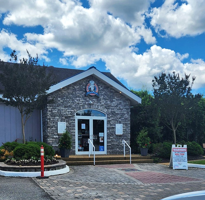 The stone facade entrance stands ready to welcome hungry philosophers and food enthusiasts alike. Even the clouds seem to gather overhead in anticipation of what's inside.