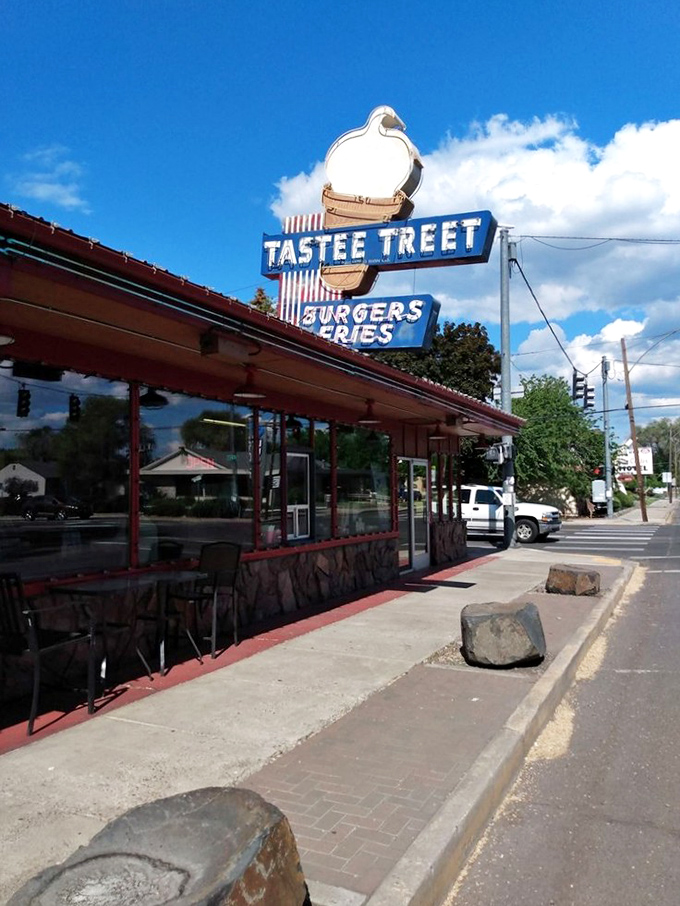 That blue Oregon sky frames the promise of comfort food ahead. The sign says "Burgers Fries" but locals know it means "Welcome Home."