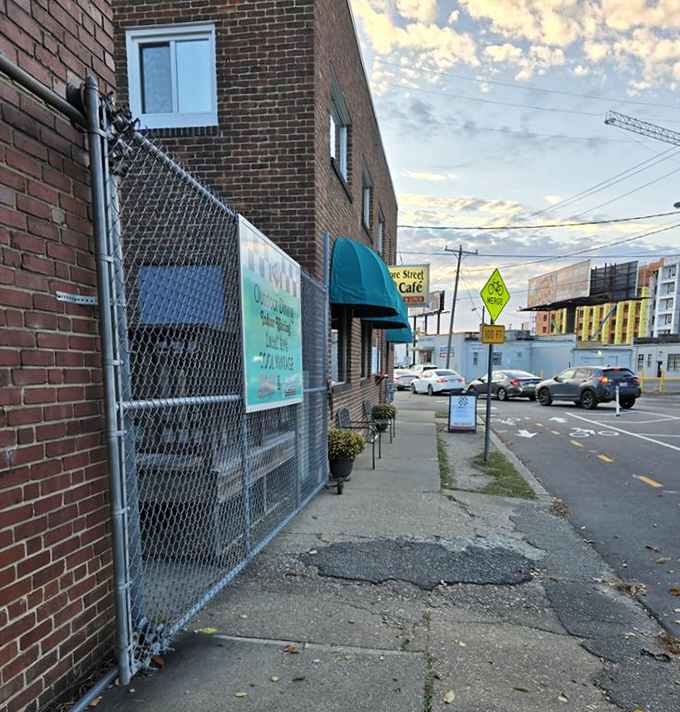 The view from the street reveals Moore Street Cafe's place in the neighborhood. That teal awning serves as a beacon for hungry souls seeking breakfast salvation.