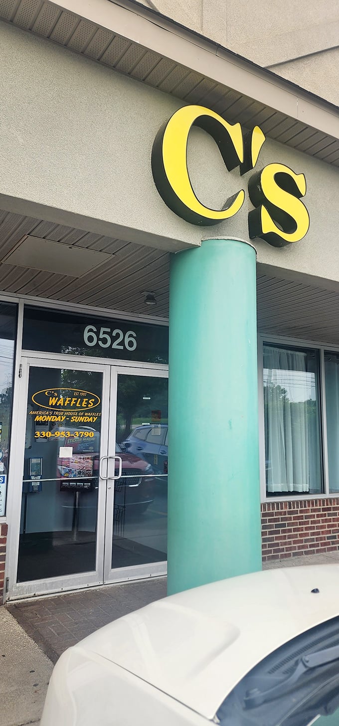The restaurant exterior might be unassuming, but that yellow sign has become a lighthouse guiding breakfast enthusiasts safely to waffle harbor.