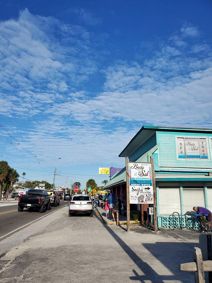 Anna Maria Island's perfect blue skies frame the turquoise building, creating a postcard-worthy scene that promises unforgettable island memories.