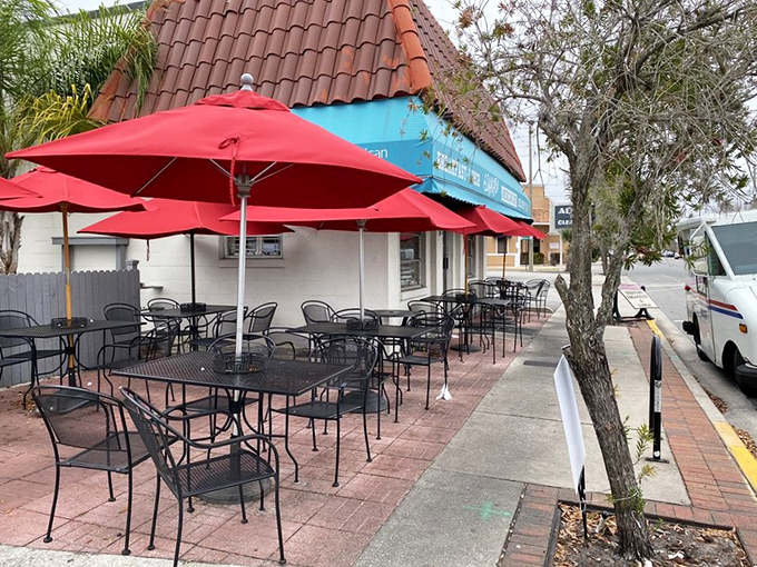 The outdoor seating area offers a perfect spot for people-watching with your pancakes. Those red umbrellas provide shade for both you and your maple syrup. 