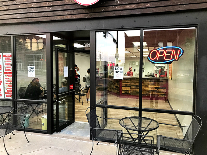 The welcoming entrance says "custard sanctuary inside." That neon "OPEN" sign might as well read "Happiness Available Here" to those in the know.