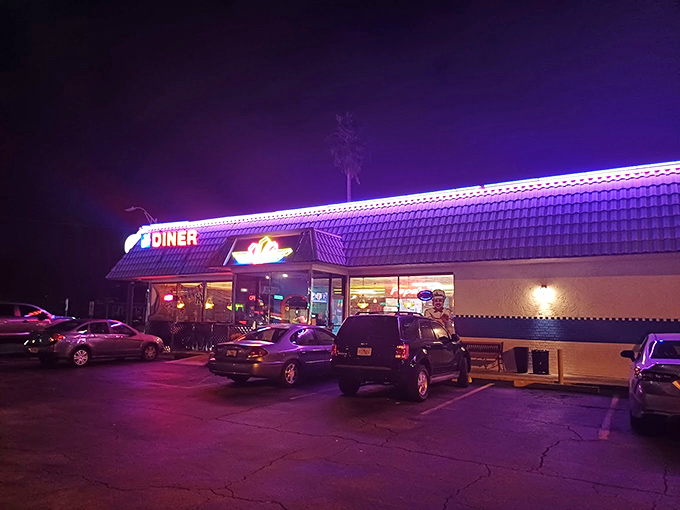 By night, Papa's neon glow transforms into a beacon for the hungry, promising that breakfast for dinner is always the right decision.