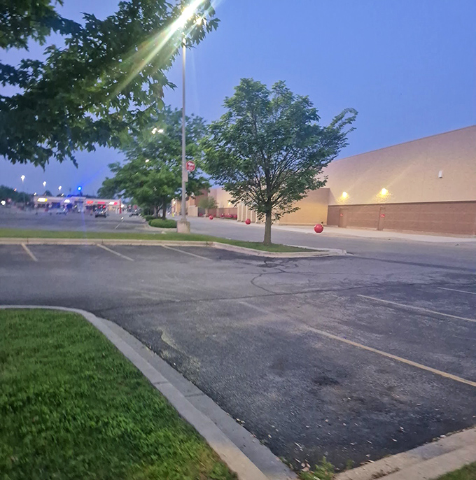 Even at dusk, the welcoming glow of the parking lot lights guides shoppers to this temple of thrift.