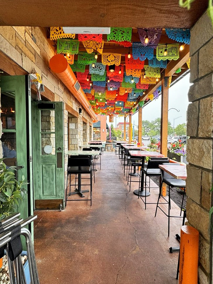 The patio's papel picado ceiling creates a kaleidoscope of color overhead. Al fresco dining with a serious dose of joy.