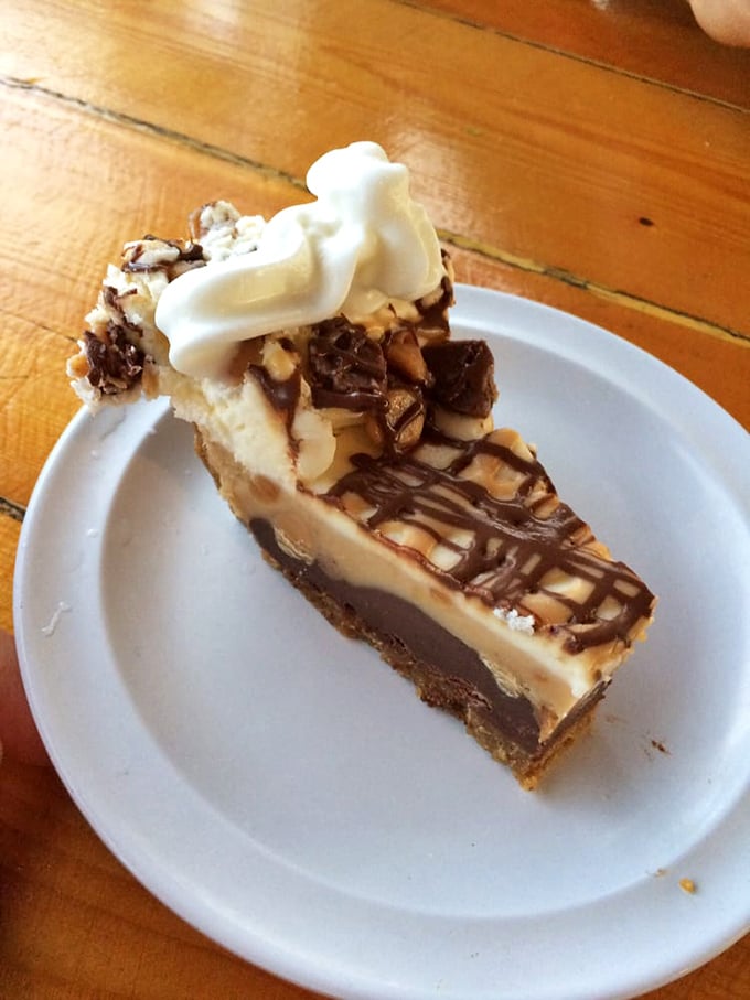 This isn't just dessert&mdash;it's a peanut butter pie that makes you question why chocolate gets all the attention, topped with a dollop of whipped cream that's basically wearing a halo.