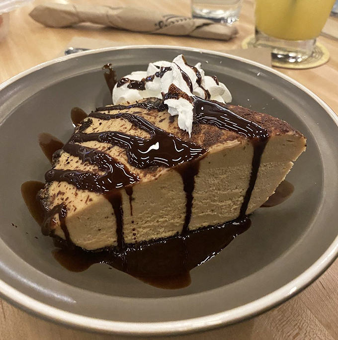 Peanut butter pie that makes time stand still. That chocolate drizzle isn't just garnish&mdash;it's the exclamation point on a perfect meal.