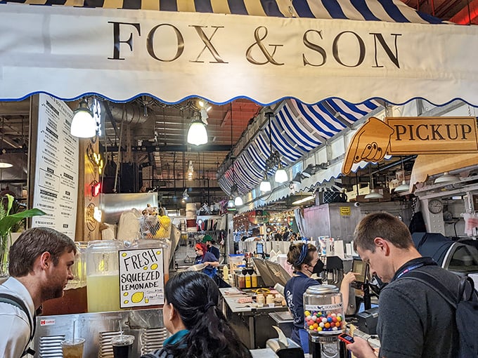 Fresh-squeezed lemonade being prepared alongside corn dog batter—proof that sometimes the best things in life are worth the wait.