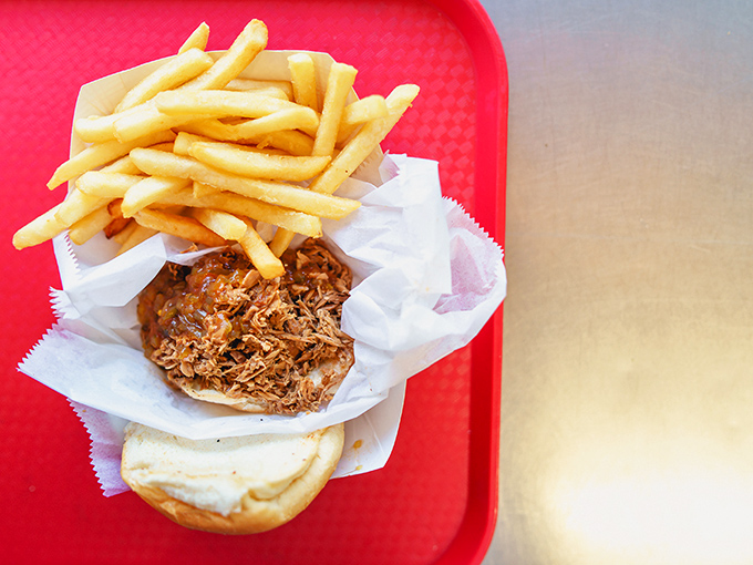 This pulled pork sandwich with golden fries isn't just lunch &ndash; it's the reason the phrase "finger-lickin' good" was invented.