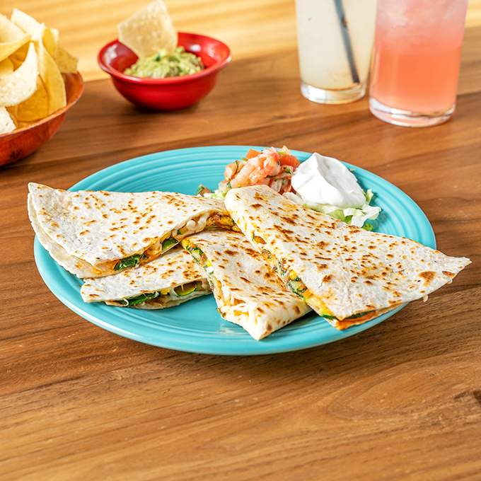 Quesadillas that make you question why you ever settled for lesser versions. Crispy, cheesy, and perfectly proportioned&mdash;the Goldilocks of Mexican comfort food.