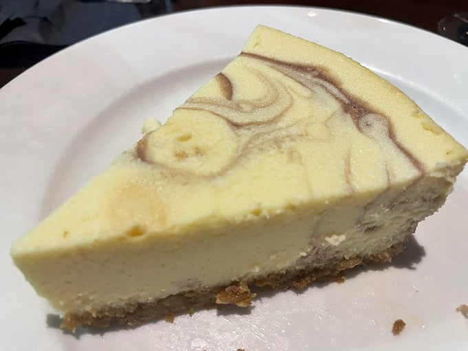 Cheesecake with artistic ambitions. That raspberry swirl isn't just decoration&mdash;it's the flavor equivalent of a plot twist in your dessert story.