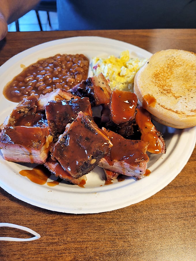 Rib tips bathed in that signature sauce, served with baked beans and cornbread&mdash;a plate that makes you understand why napkins were invented.