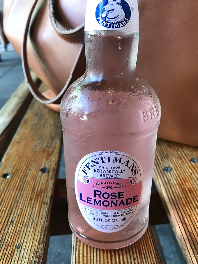 A bottle of rose lemonade, beaded with condensation. The perfect companion for pizza on a Berkeley afternoon.
