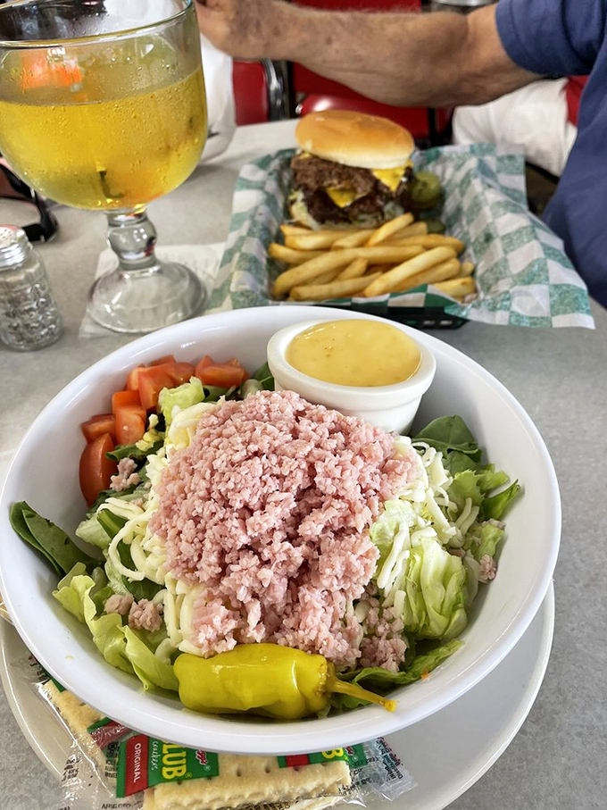 A chef's salad that doesn't pretend to be diet food, topped with generous portions of ham and cheese&mdash;honesty on a plate.