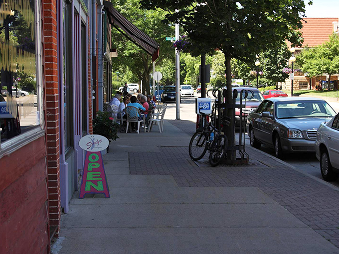 Sidewalk seating invites passersby to pause and become part of the street scene. In Eau Claire, even a simple coffee break feels like you're in a delightful indie film.