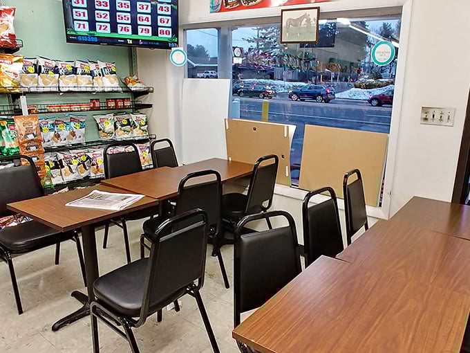 The modest seating area isn't designed for lingering—it's a practical pit stop for the serious business of sandwich consumption.