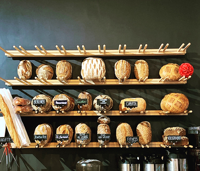 Bread displayed like the treasures they are, each loaf with its own personality and purpose. This isn't just baking&mdash;it's edible sculpture with soul.