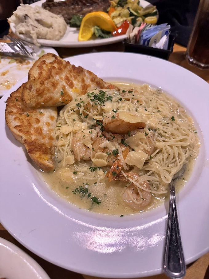 Shrimp scampi that makes pasta feel privileged. Bathed in a sauce so good you'll be plotting ways to soak up every last drop with that garlic bread.