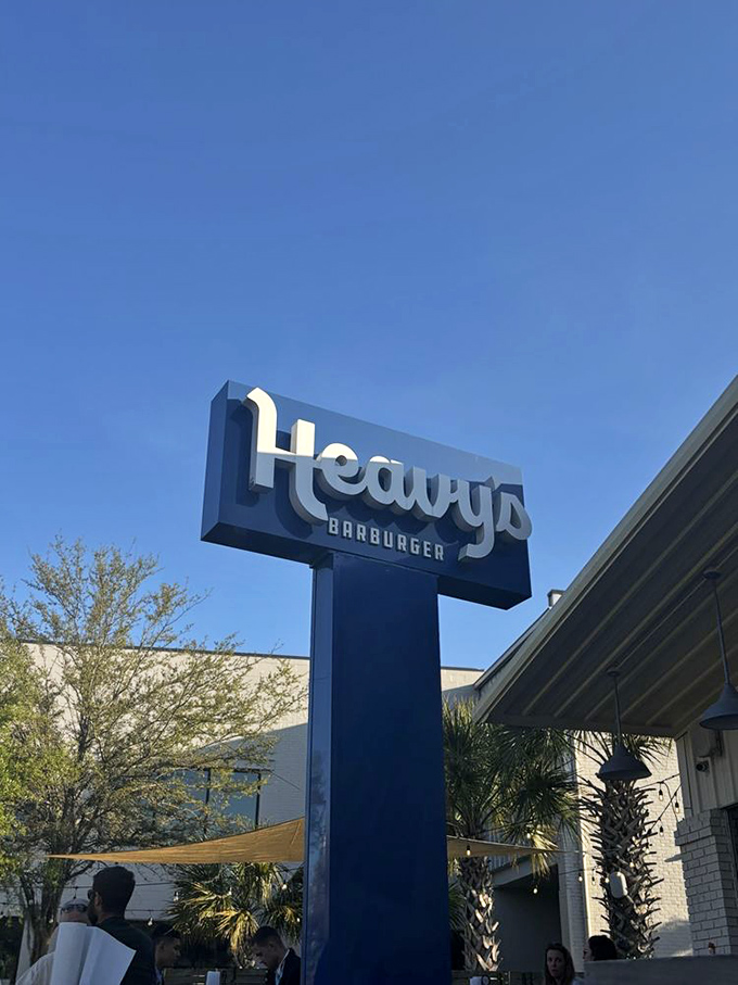The sign that's guided countless hungry pilgrims to burger salvation. Blue against Carolina sky&mdash;a beacon of hope for empty stomachs.