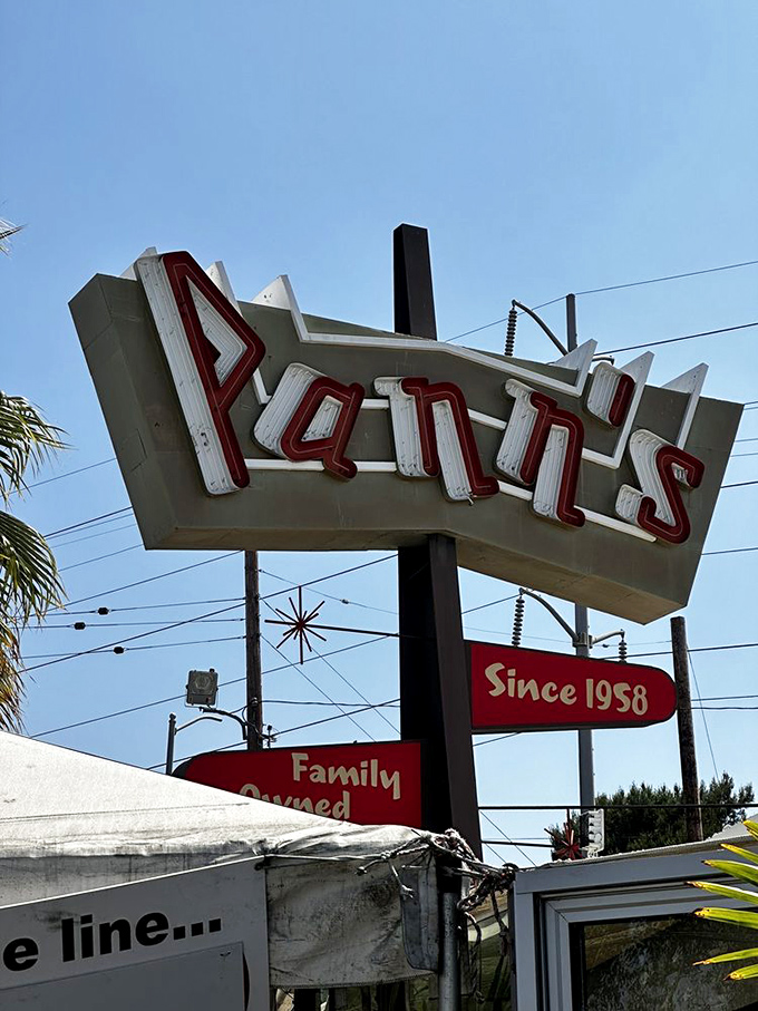 That sign isn't just advertising&mdash;it's a beacon of hope for hungry travelers, promising salvation in the form of perfectly cooked comfort food.