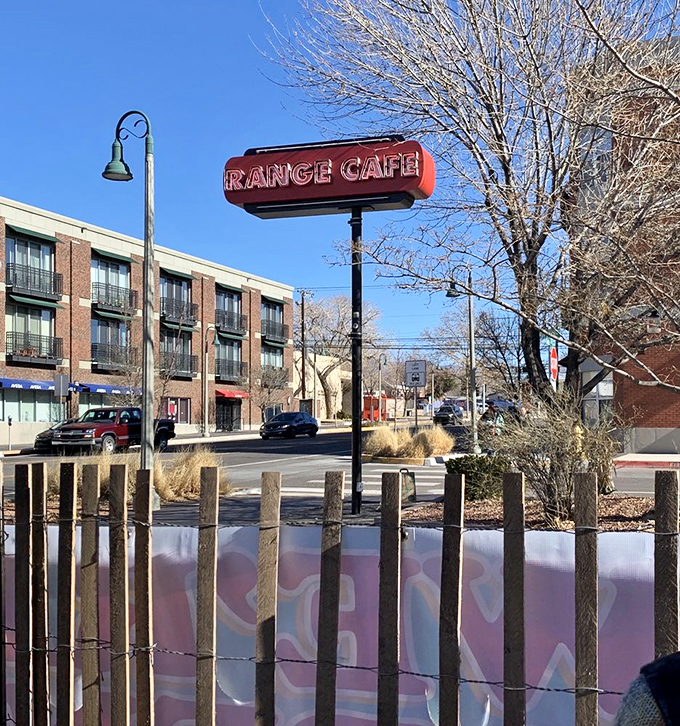 The Range Cafe sign stands as a landmark against Albuquerque's brilliant blue sky&mdash;a beacon for those seeking the legendary mac and cheese within.