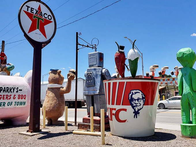 A welcoming committee of pop culture icons stands ready outside. This roadside menagerie hints at the creative spirit waiting inside Sparky's doors.