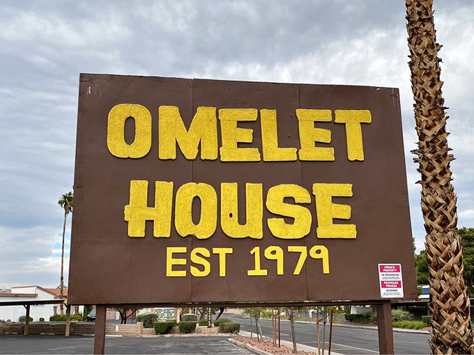 That sign has weathered decades of Vegas sun, standing sentry over countless breakfast pilgrimages. Yellow letters promising golden eggs inside.