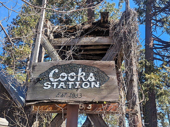 A sign with stories to tell. Established in 1933, this weathered marker has witnessed generations of hungry travelers seeking mountain comfort.