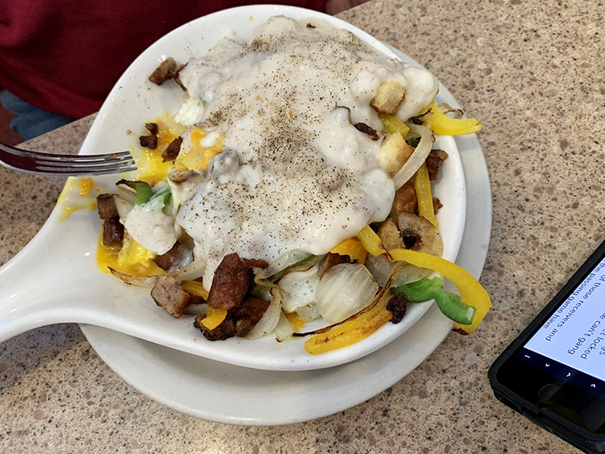 The breakfast skillet&mdash;where eggs, cheese, peppers and potatoes have a morning meeting under a cozy blanket of country gravy.