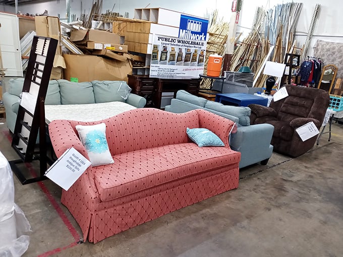 The living room section: where vintage sofas dream of their second chance. That pink beauty is just waiting for someone to recognize its potential.
