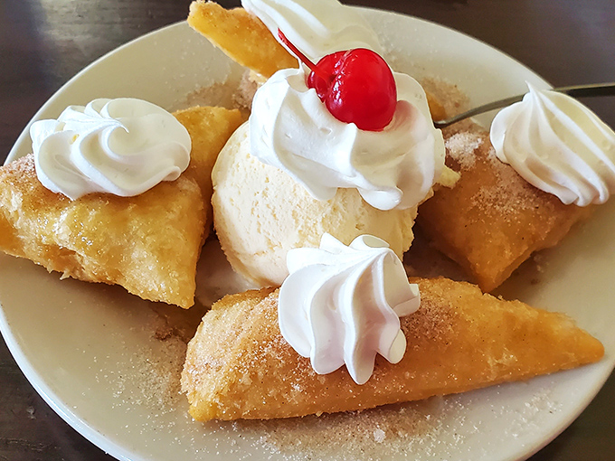 Crispy sopapillas dusted with cinnamon sugar and topped with whipped cream. These pillowy dessert triangles prove that the best meals end with something sweet, fried, and utterly irresistible.
