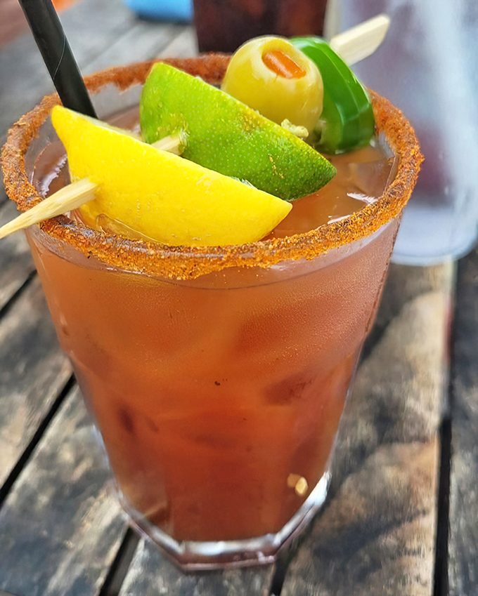 This isn't just a Bloody Mary; it's a spicy, garnish-laden work of art that doubles as an appetizer. Breakfast of champions, vacation edition.