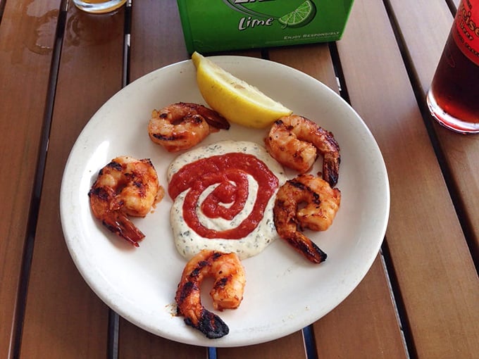 Grilled shrimp arranged like a clock around a creamy sauce spiral&mdash;proof that simple ingredients with proper technique create food that's both art and satisfaction.