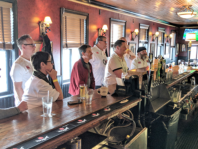 The front line of hospitality stands ready at Slainte's bar&mdash;guardians of good times and perfect pours awaiting your next order.