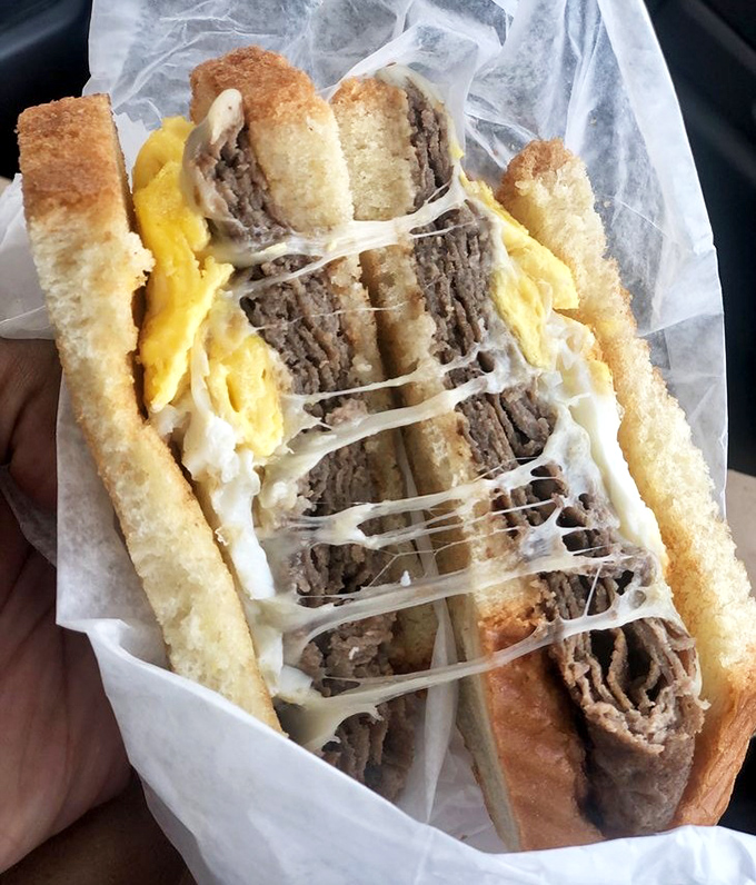 Steak and cheese sandwich wrapped tight, ready for those who prefer their comfort food portable.