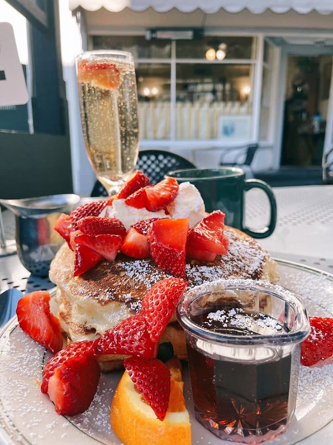 Strawberry pancakes that make you understand why people write songs about California. That maple syrup container isn't just holding syrup&mdash;it's cradling liquid gold.