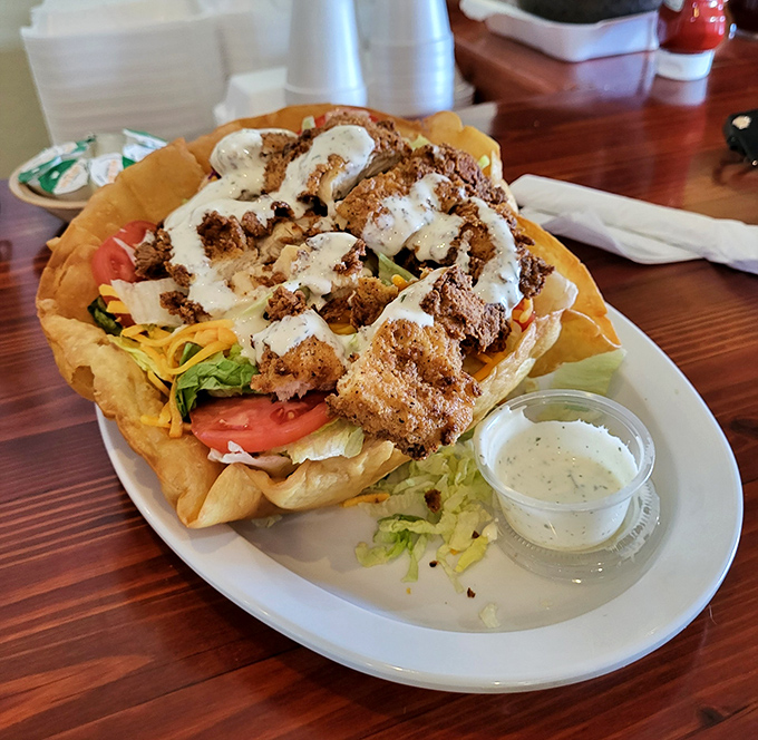 A taco salad that abandoned all notions of restraint. The fried tortilla bowl is merely a vessel for delicious excess.