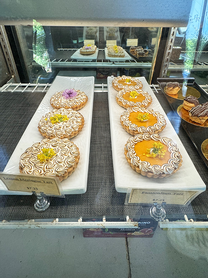Tarts lined up like jewels in a display case, each one promising a different path to dessert enlightenment. 